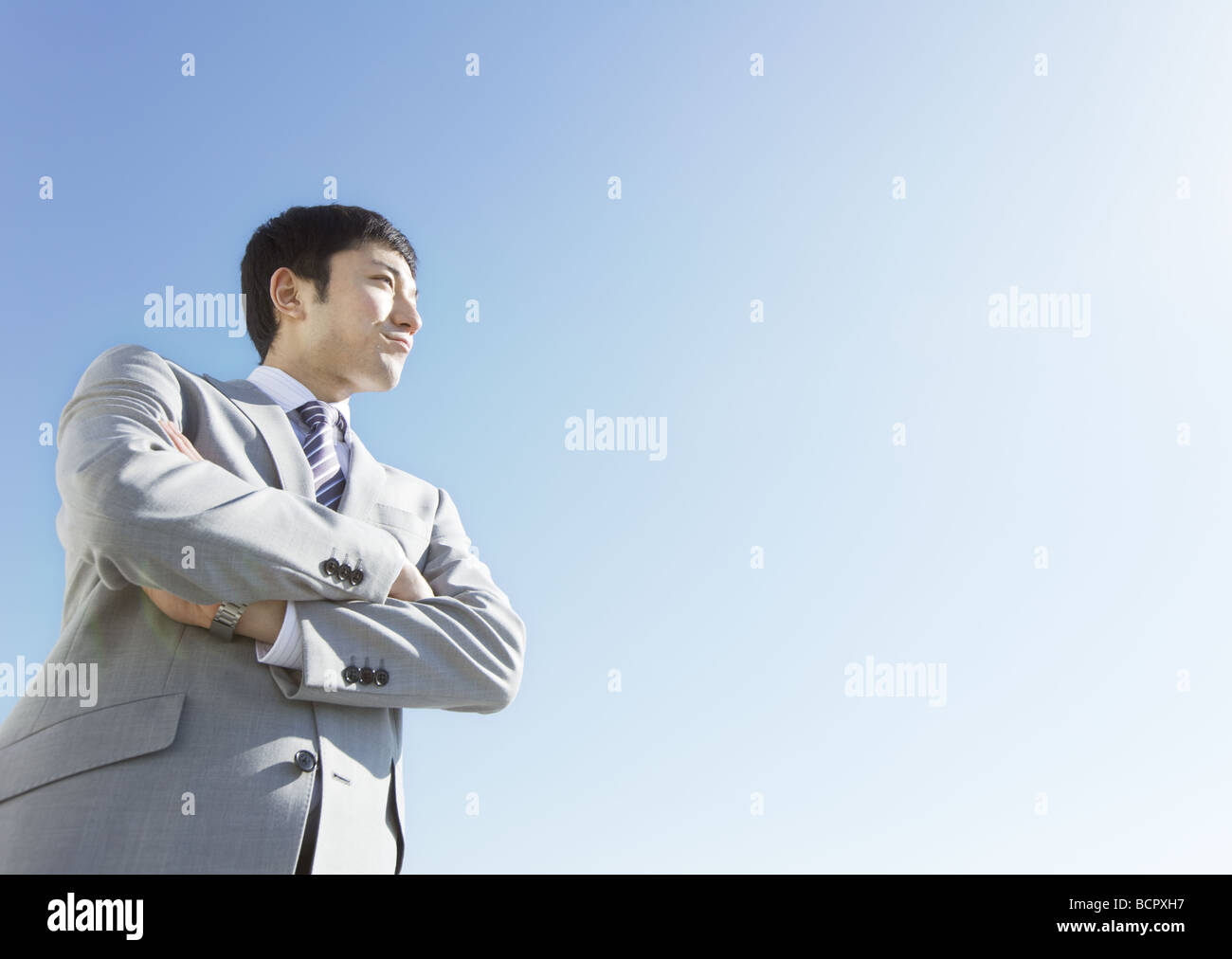 Businessman looking up Stock Photo - Alamy