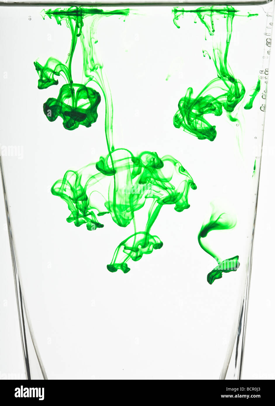 Colored food dye droplets floating in water to make abstract patterns ...