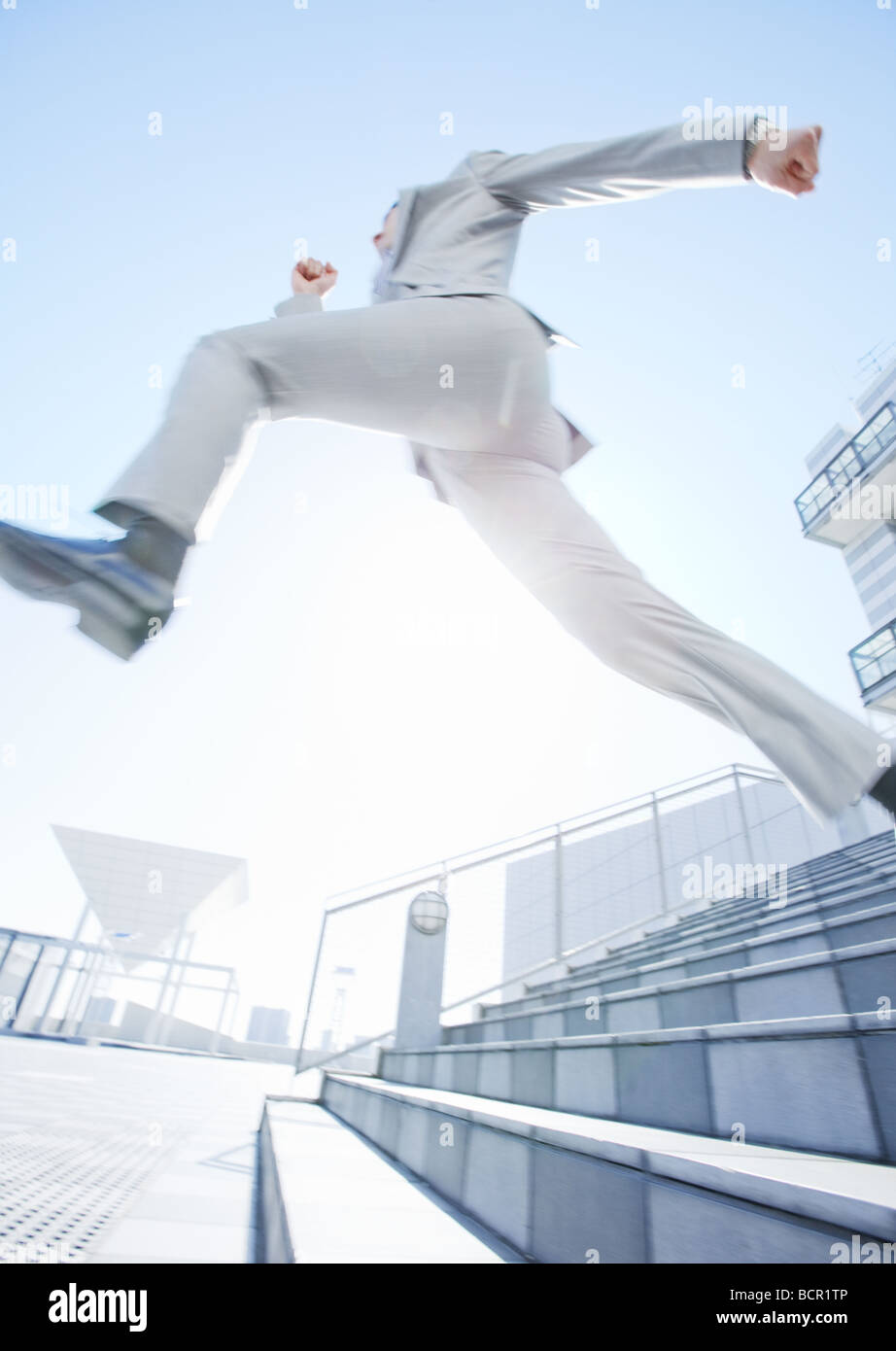 Jumping down stairs hi-res stock photography and images - Alamy