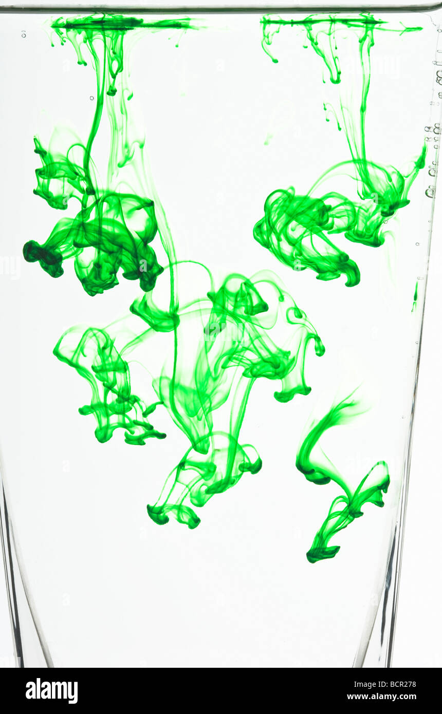 Colored food dye droplets floating in water to make abstract patterns ...