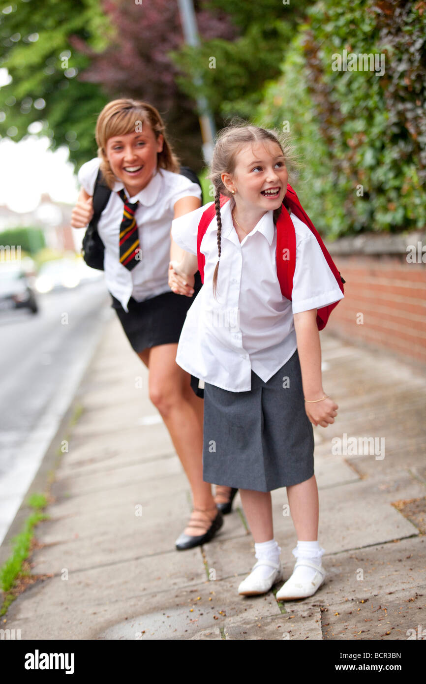 Girls walking to school Stock Photo - Alamy