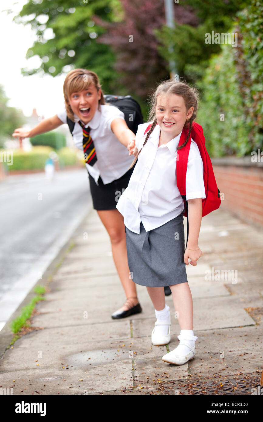 Girls walking to school Stock Photo - Alamy