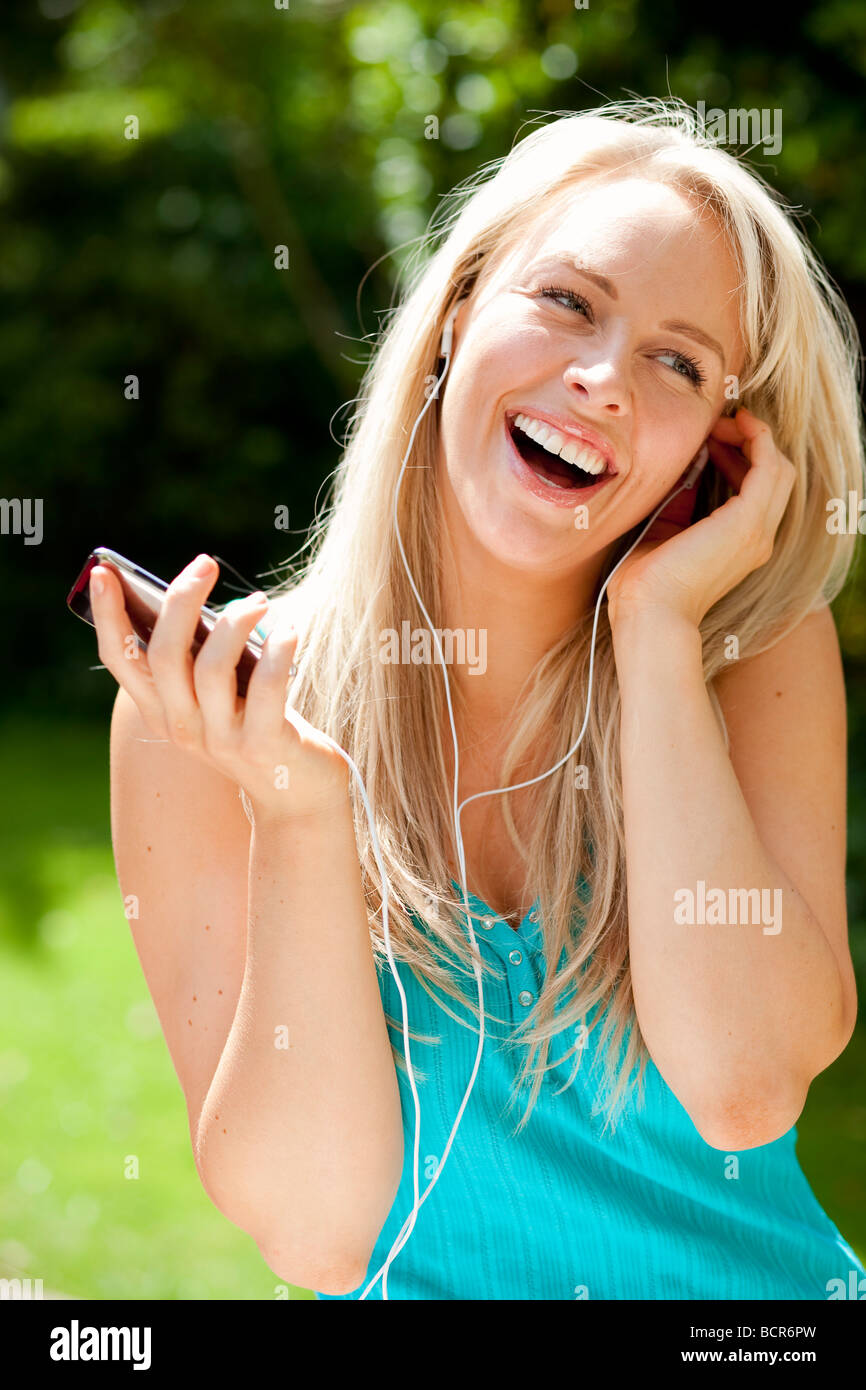 Girl listening to iPod Stock Photo - Alamy