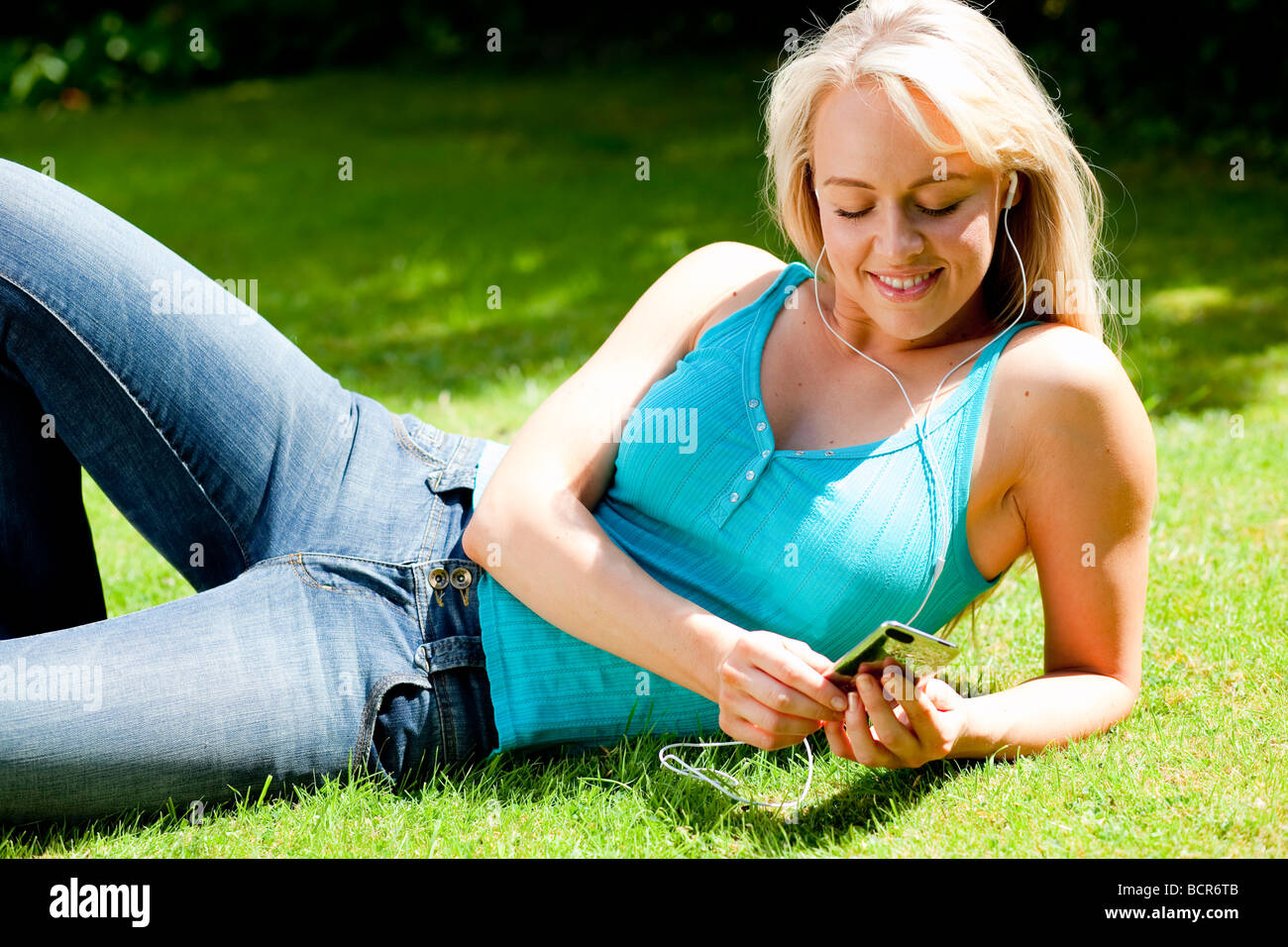 Girl listening to iPod Stock Photo - Alamy