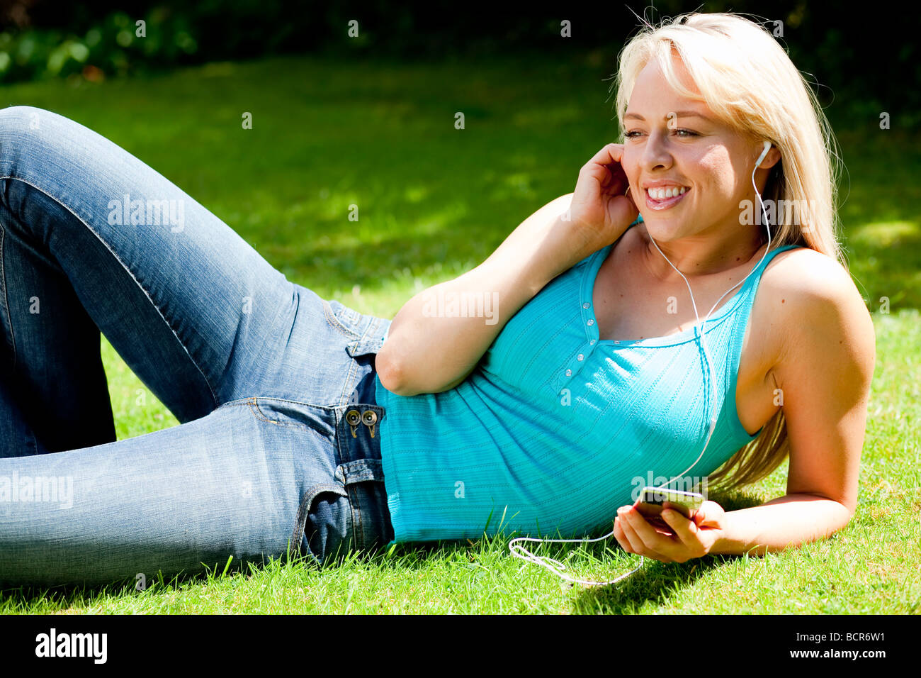 Girl listening to iPod Stock Photo - Alamy