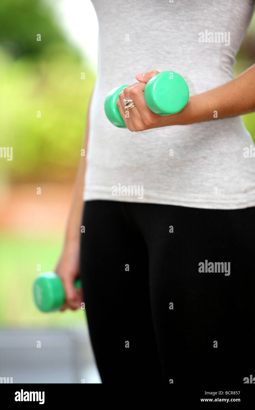 Young Woman with Weights Model Released Stock Photo - Alamy