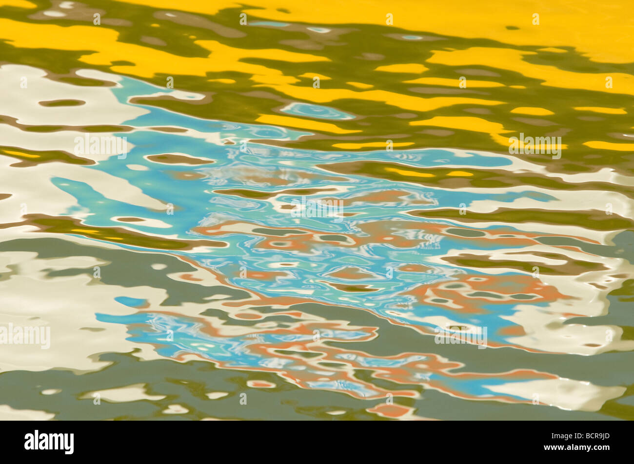 Reflections on water ripples yellow and blue fine art Stock Photo - Alamy