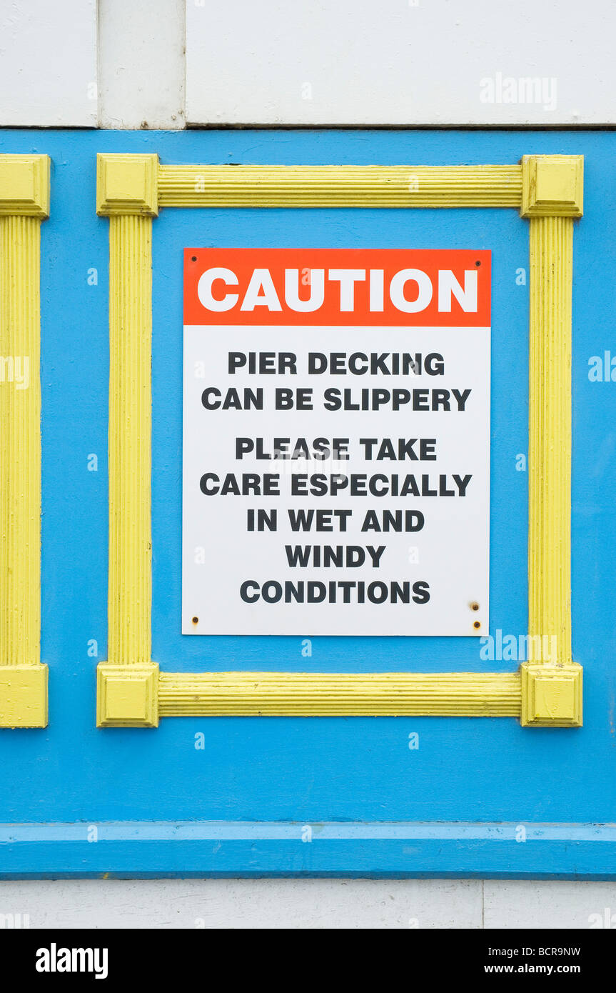 Caution sign close up on central pier Blackpool Lancashire England UK ...