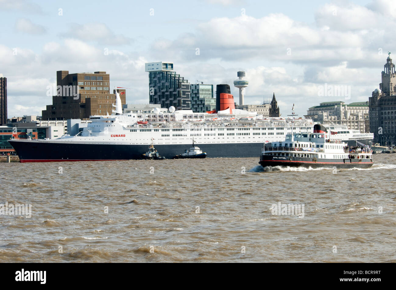 QE2 Ship on River Mersey Liverpool with Liver Building and skyline in ...