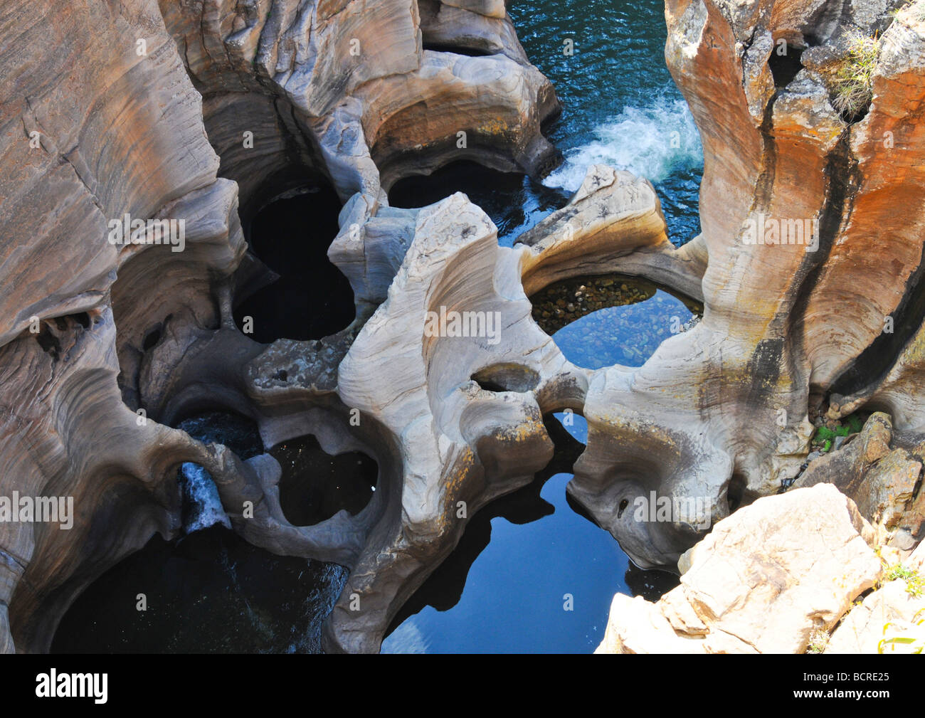 View of highly colourful Bourke's Luck Potholes and ancient geological ...