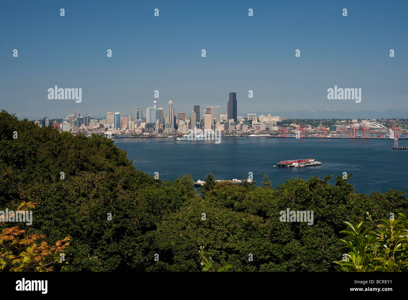 Seattle skyline from West Seattle with boats in Elliott Bay on a bright ...