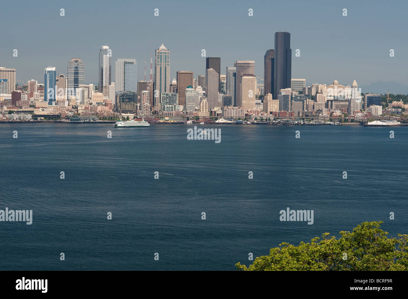 Seattle skyline from West Seattle with boats in Elliott Bay on a bright ...