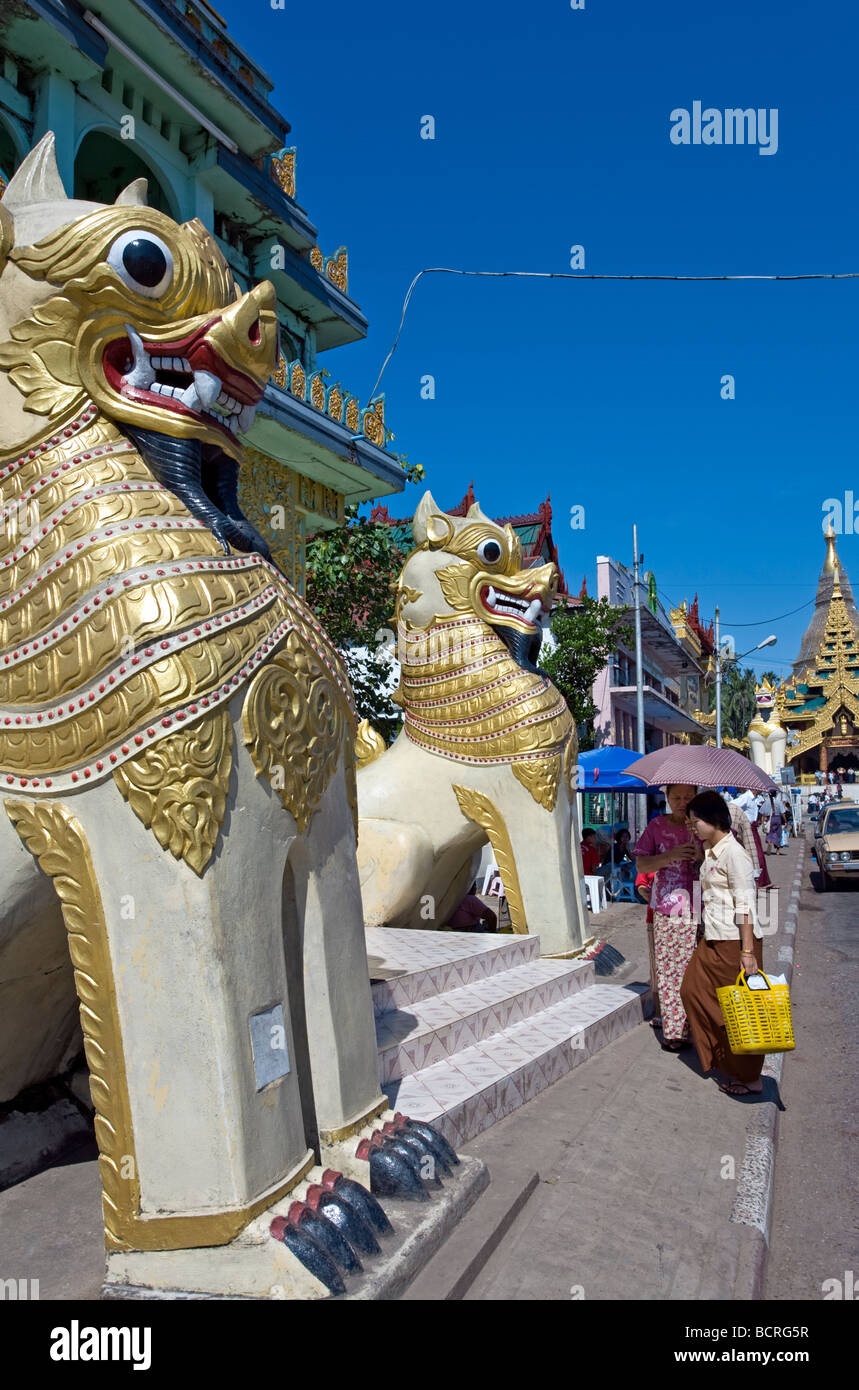 Chinthe statues (half lion half dragon). Buddhist temple. Yangon ...