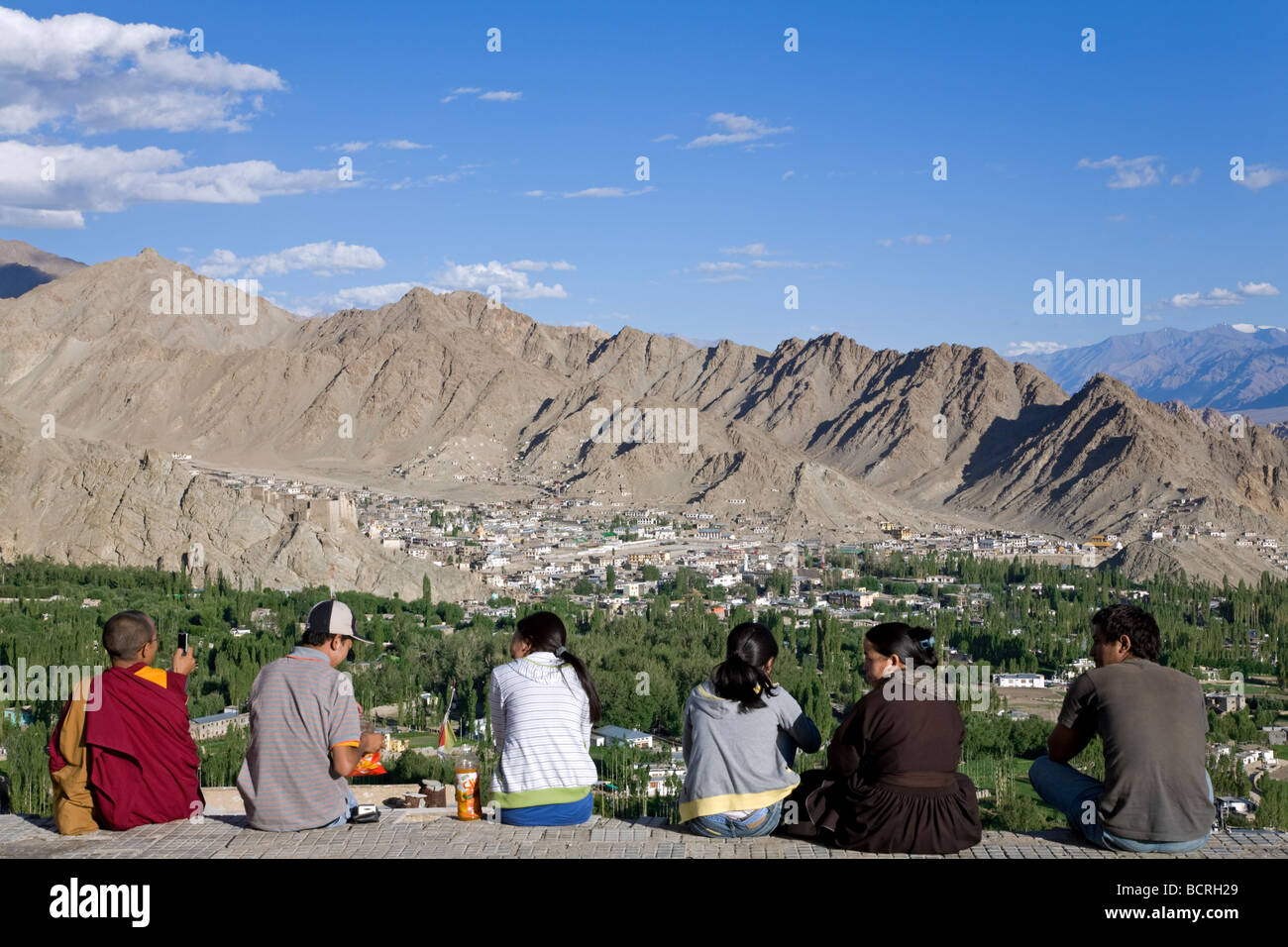 Ladakhi people contemplating Leh from Shanti Stupa viewpoint. Leh ...