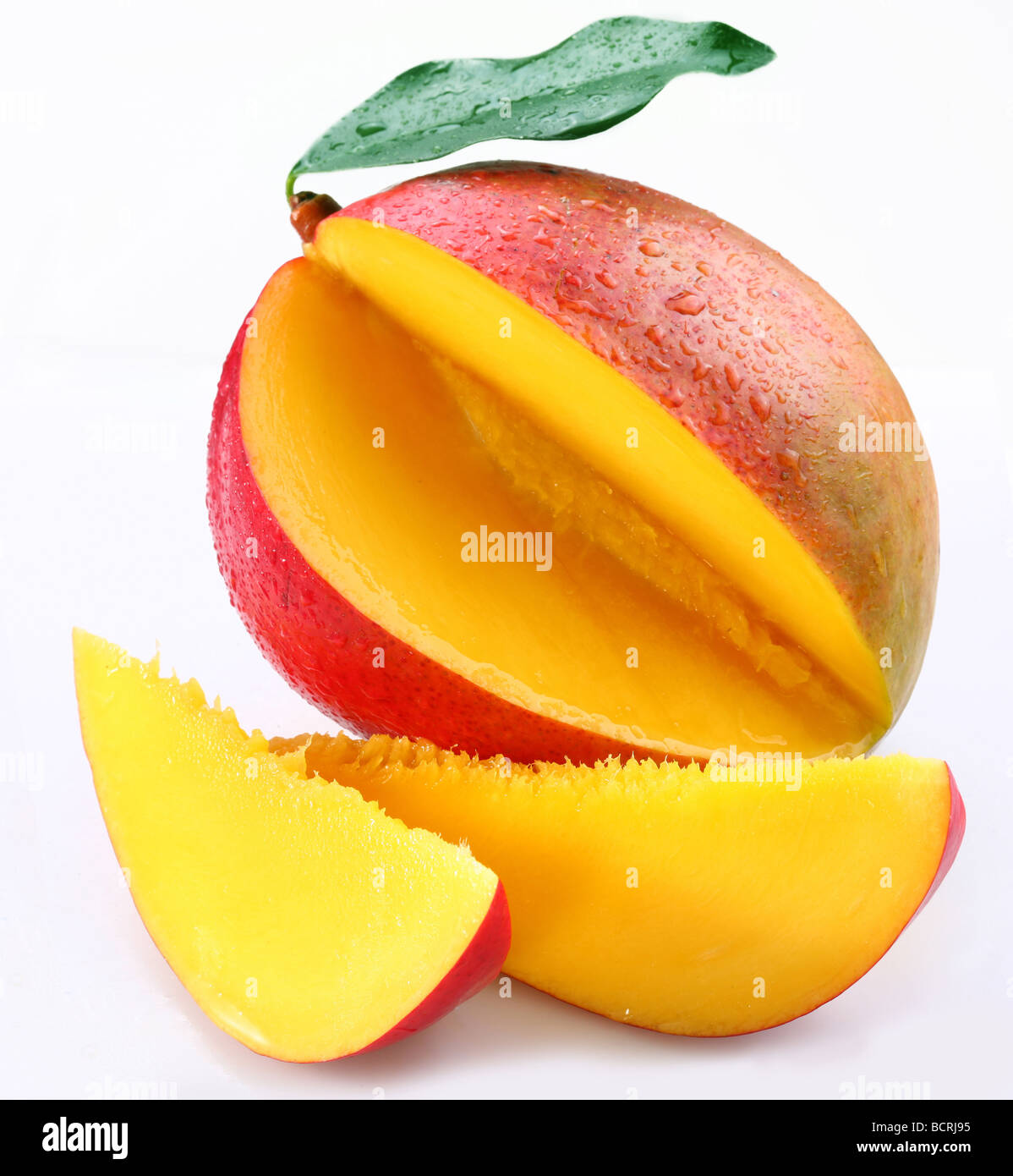 Mango with section on a white background Stock Photo - Alamy