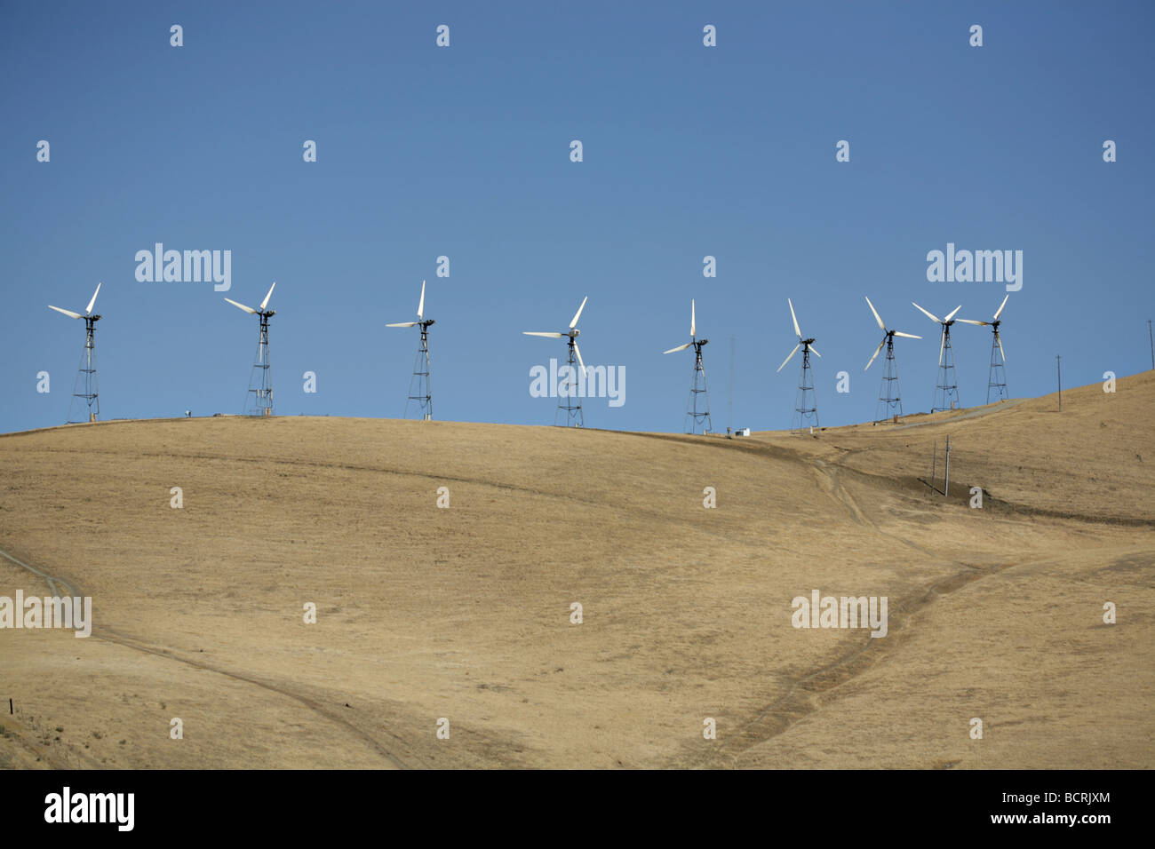 Hilltop windmills, turn, producing energy Stock Photo - Alamy