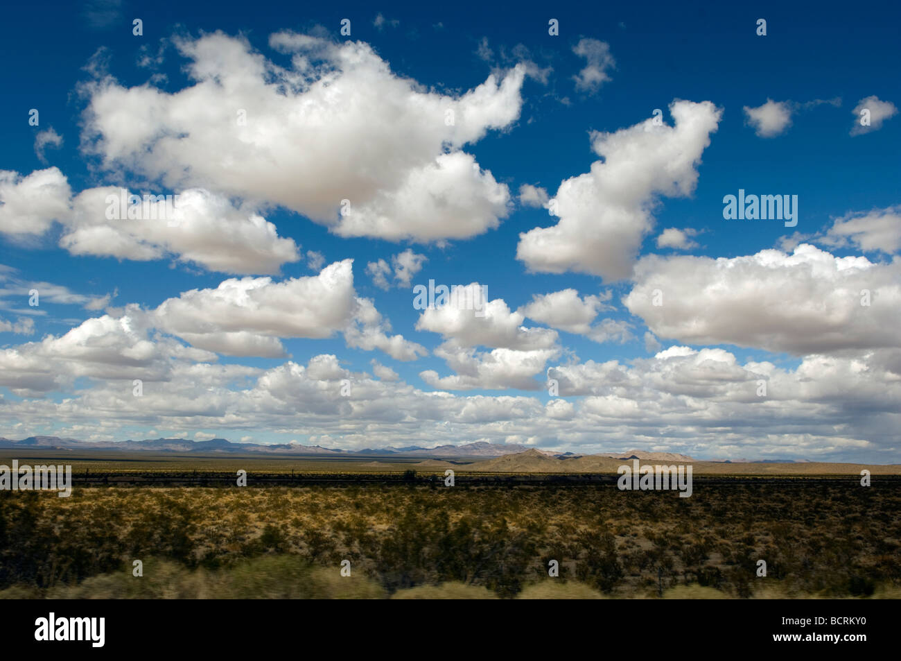 Clouds over desert Stock Photo - Alamy