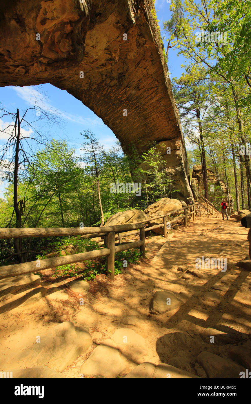 Hiker on trail beneath the Natural Bridge Natural Bridge State Resort ...