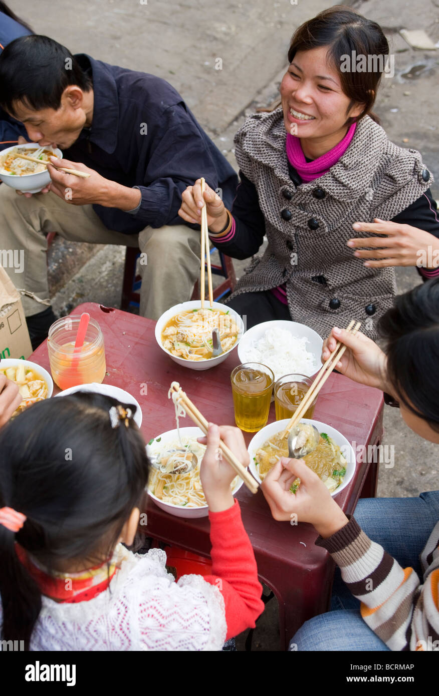 Group of Diners Street Food Stall Hanoi Vietnam Stock Photo - Alamy
