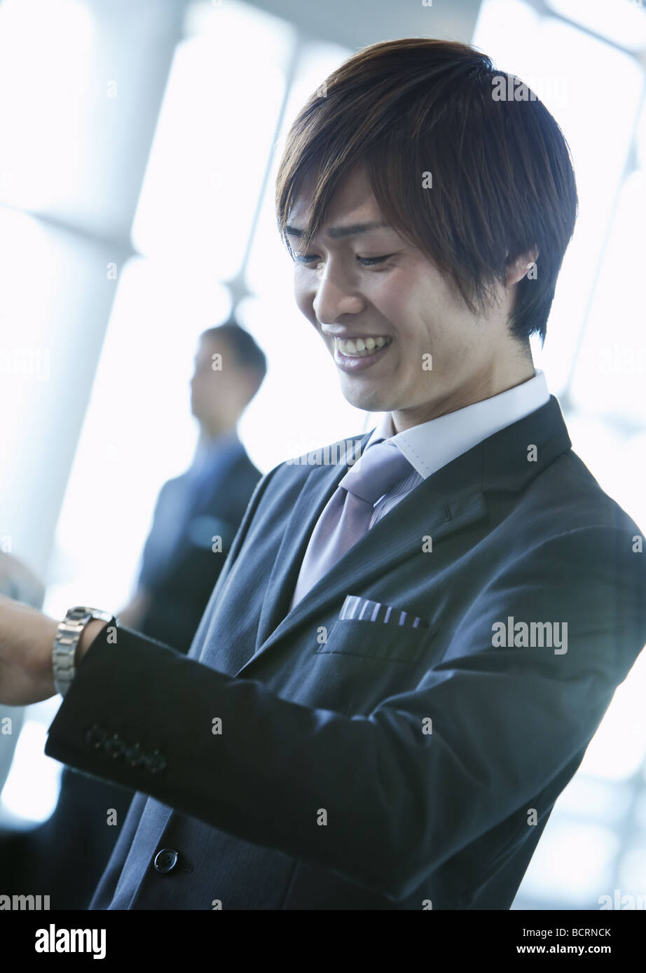 A smiling businessman Stock Photo - Alamy