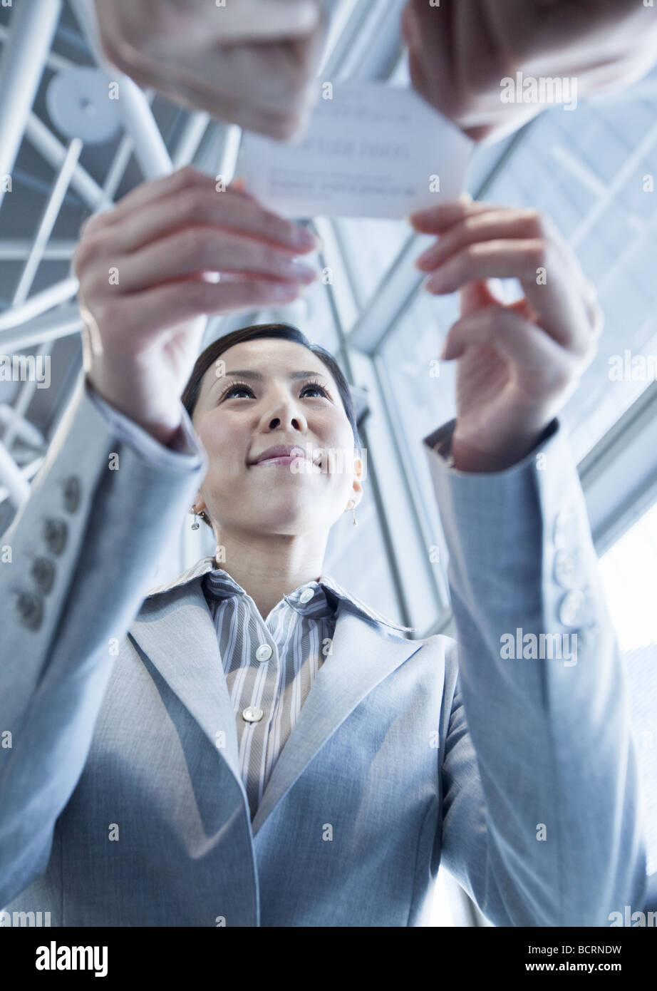 Businesswoman giving name card Stock Photo - Alamy