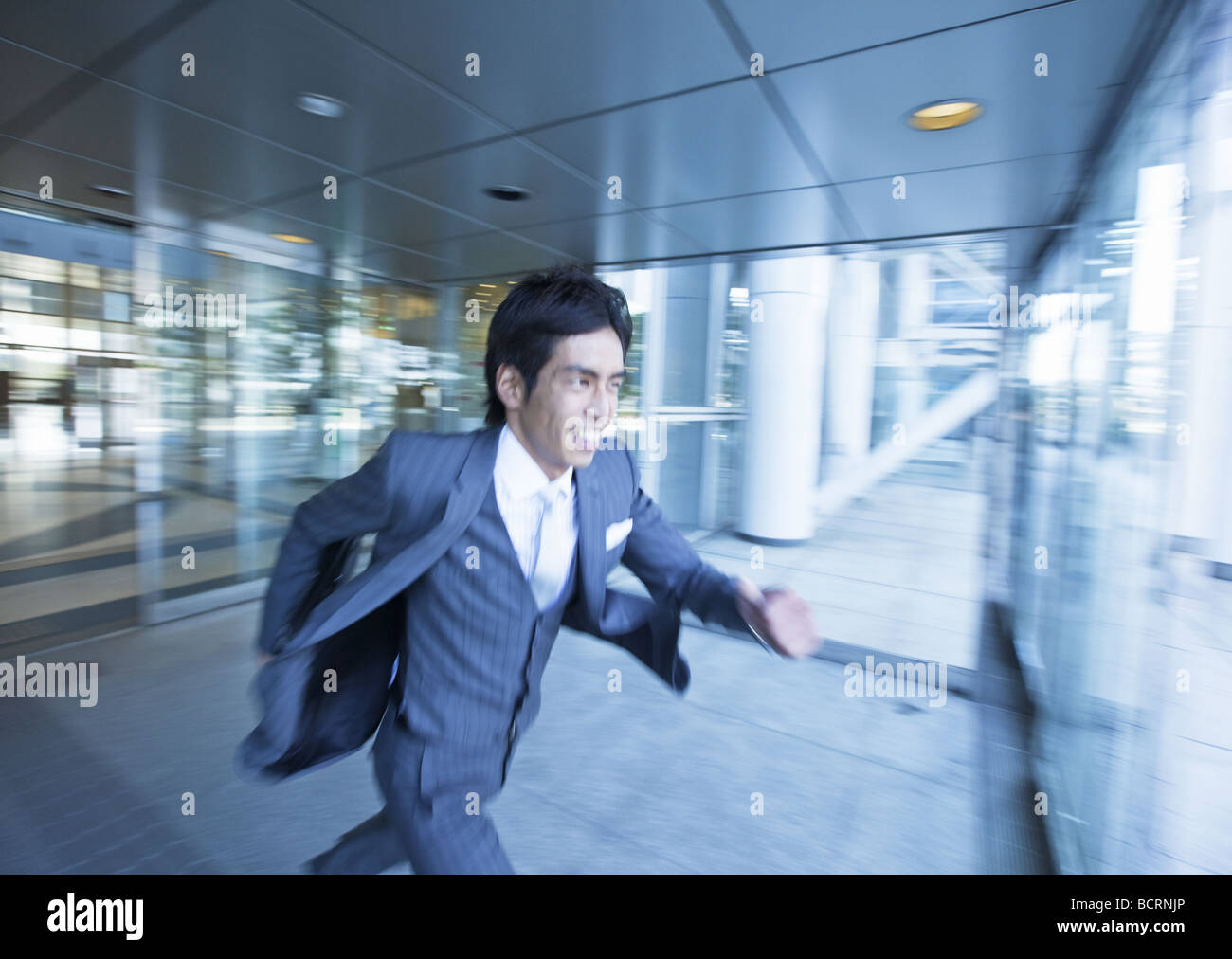 A businessman running Stock Photo - Alamy