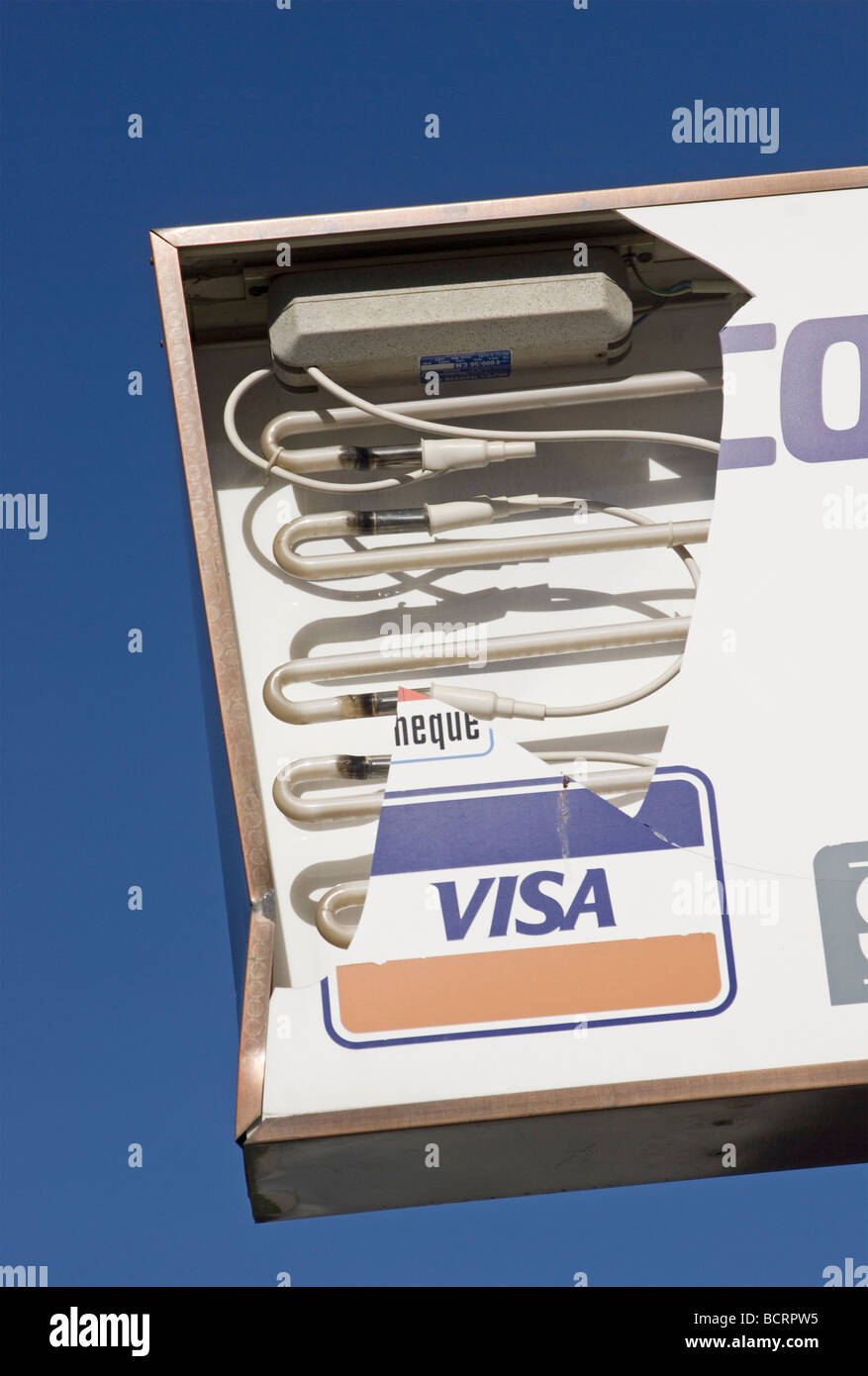 damaged credit card logos on a sign outside a bank Stock Photo - Alamy