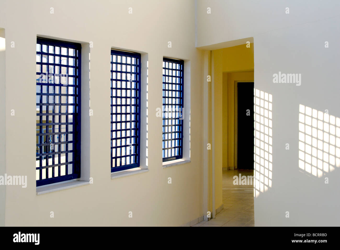Sunlight through windows of Greek style building Greece Stock Photo - Alamy
