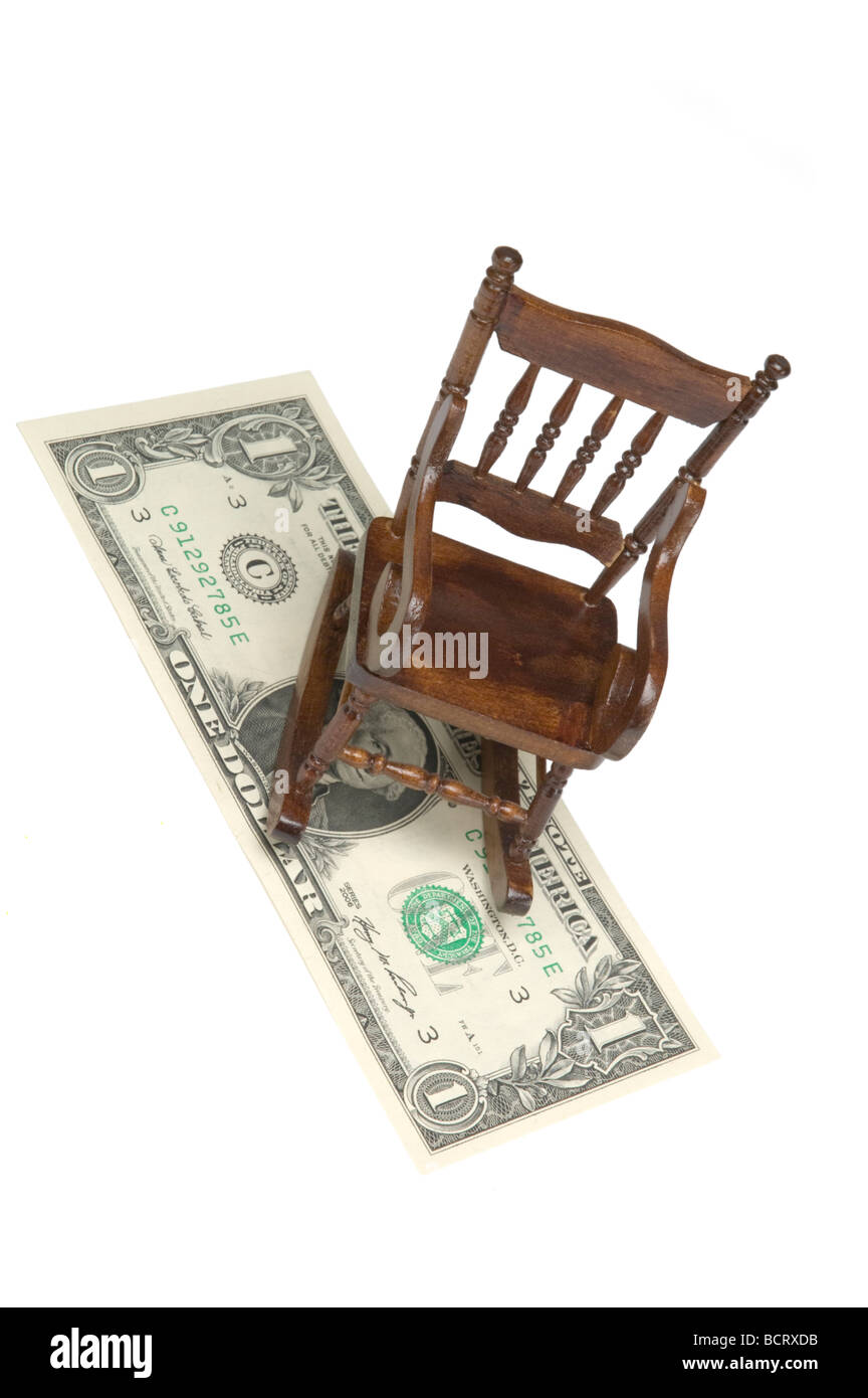 Wooden rocking chair on top of an American one dollar bill Stock Photo ...