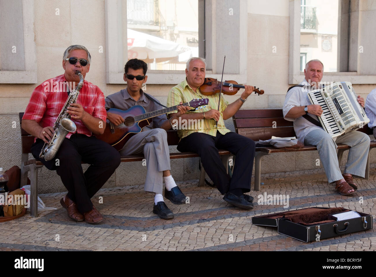 Four Portuguese Street Musicians playing in Faro town centre Stock ...