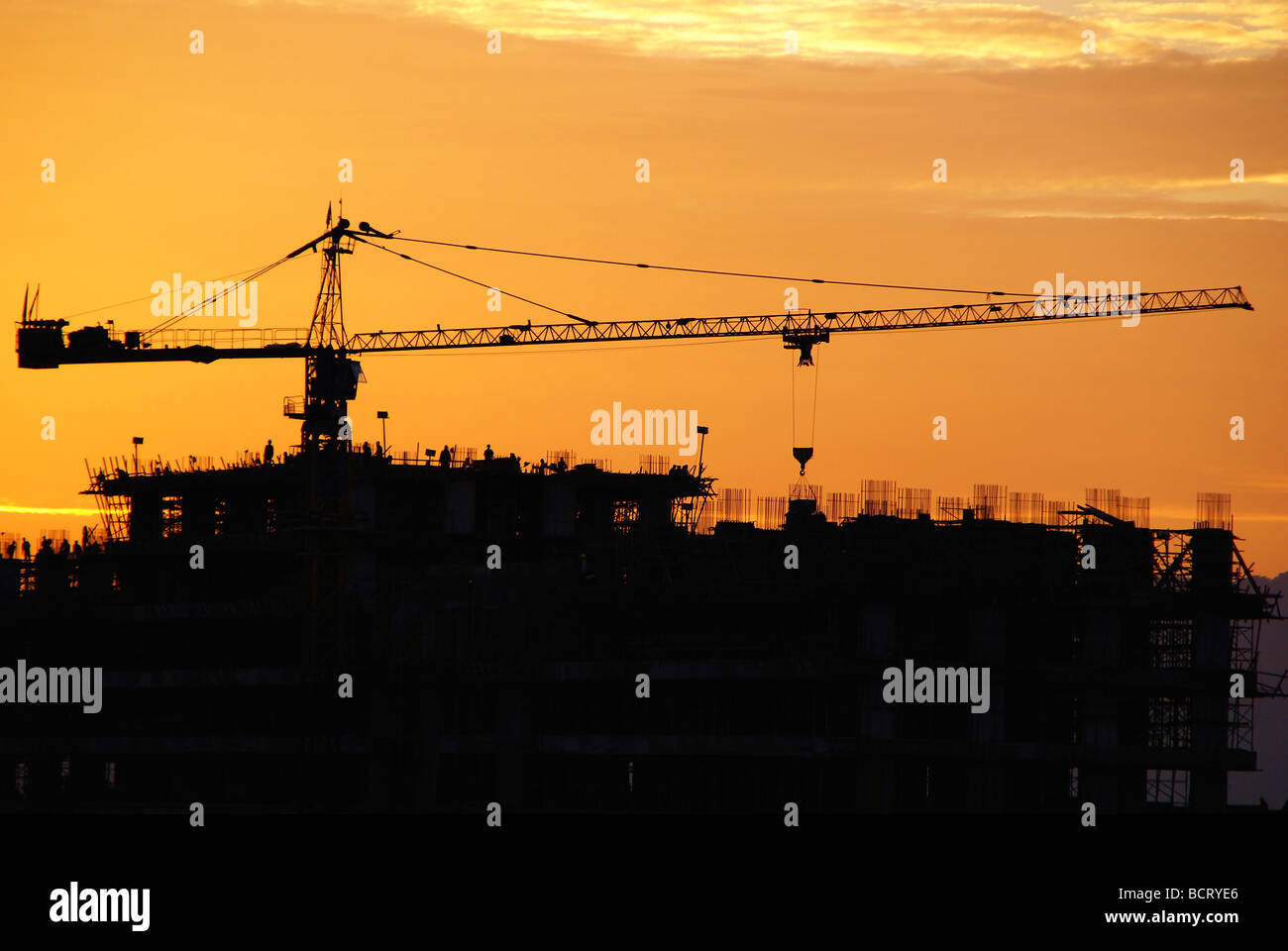 Construction crane at sunset Stock Photo - Alamy