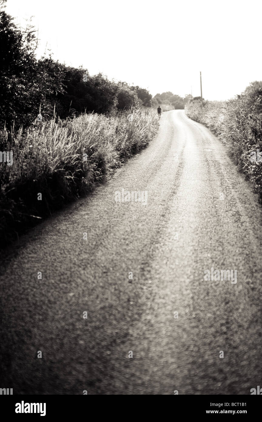 Man walking country lane hi-res stock photography and images - Alamy