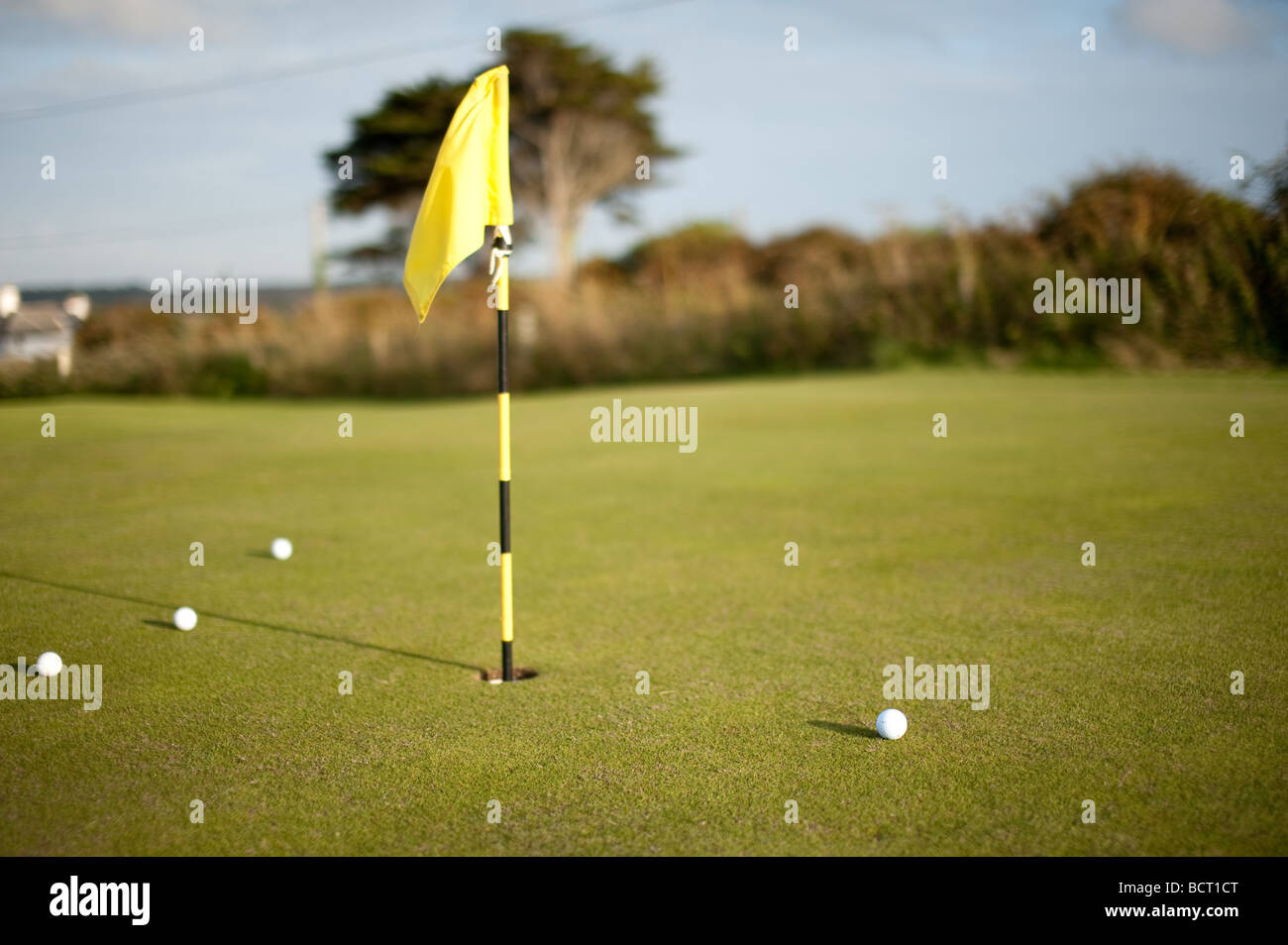 Golf course, flags and balls Stock Photo - Alamy