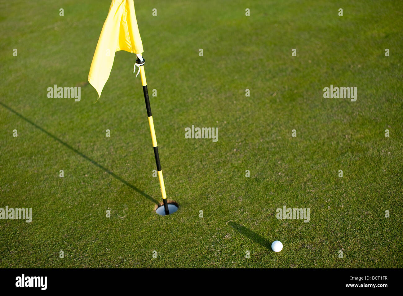 Golf course, flags and balls Stock Photo - Alamy