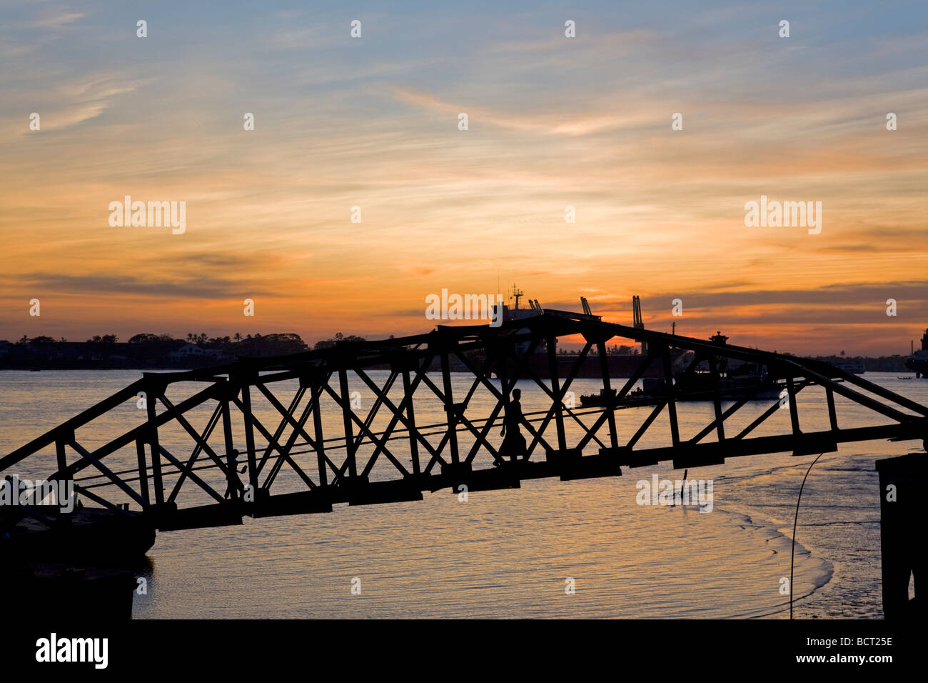 People crossing a bridge over Yangon river. Botataung jetty. Yangon ...