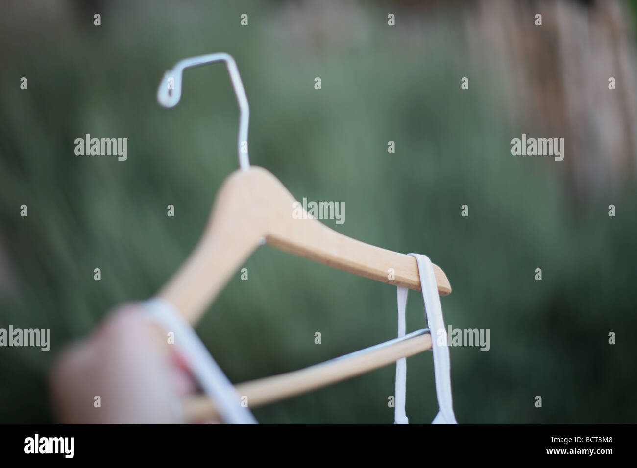 Hand clothes hanger hi-res stock photography and images - Alamy