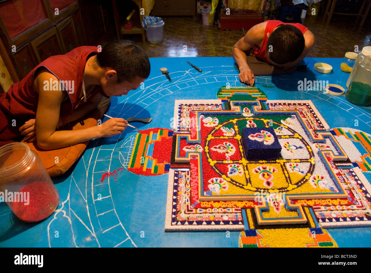 Buddhist monks working on a sand mandala at the Dip Tse Chock Ling ...