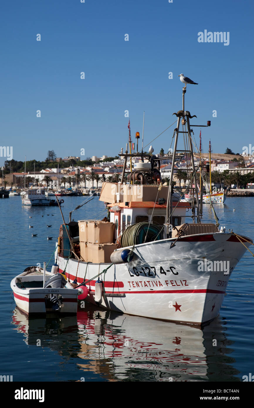 Colourful Portuguese fishing boats in the harbour of Lagos, Portugal ...