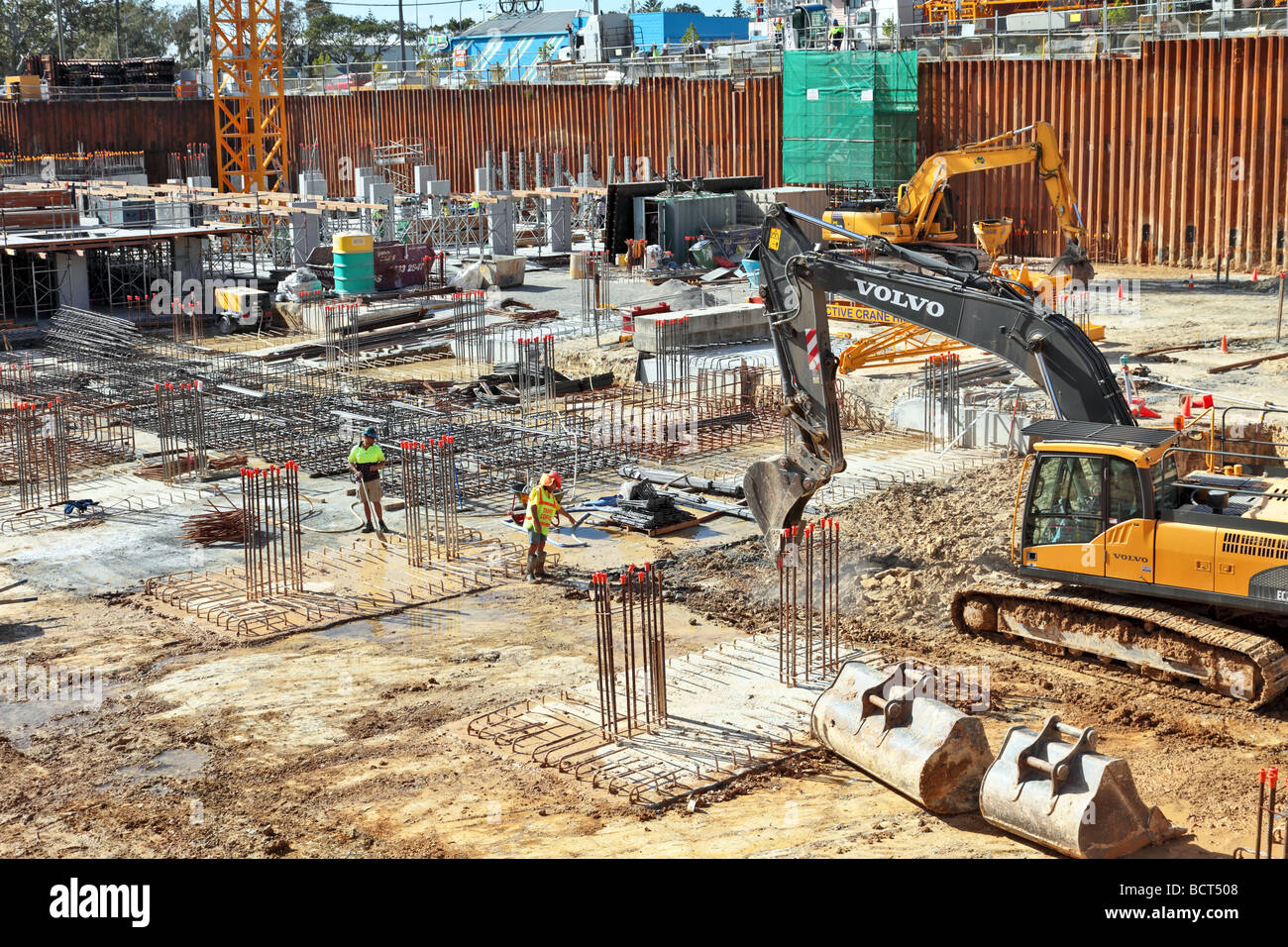 Constructing the concrete and steel foundations for a highrise building ...