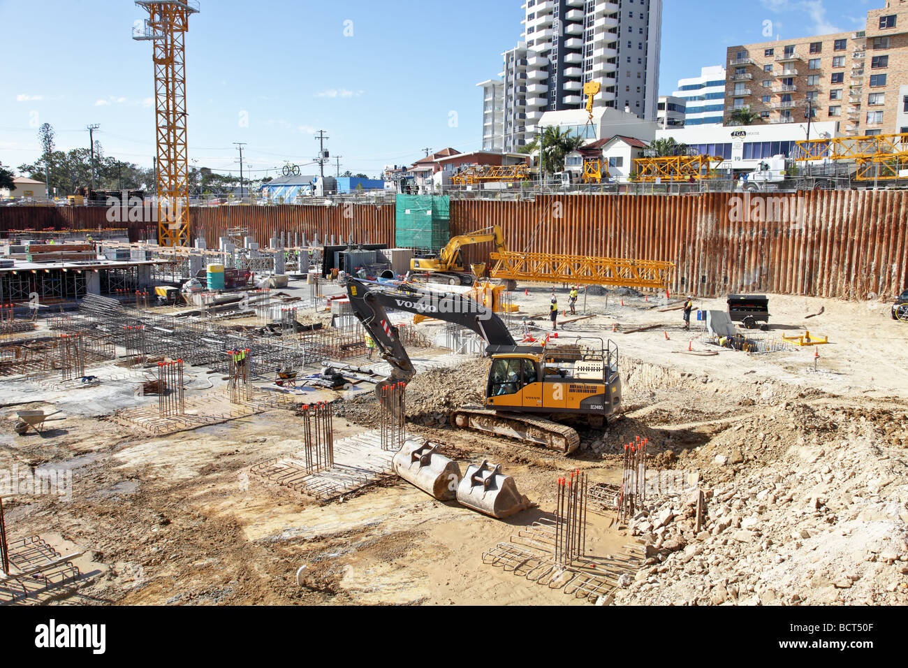 Constructing the concrete and steel foundations for a highrise building ...