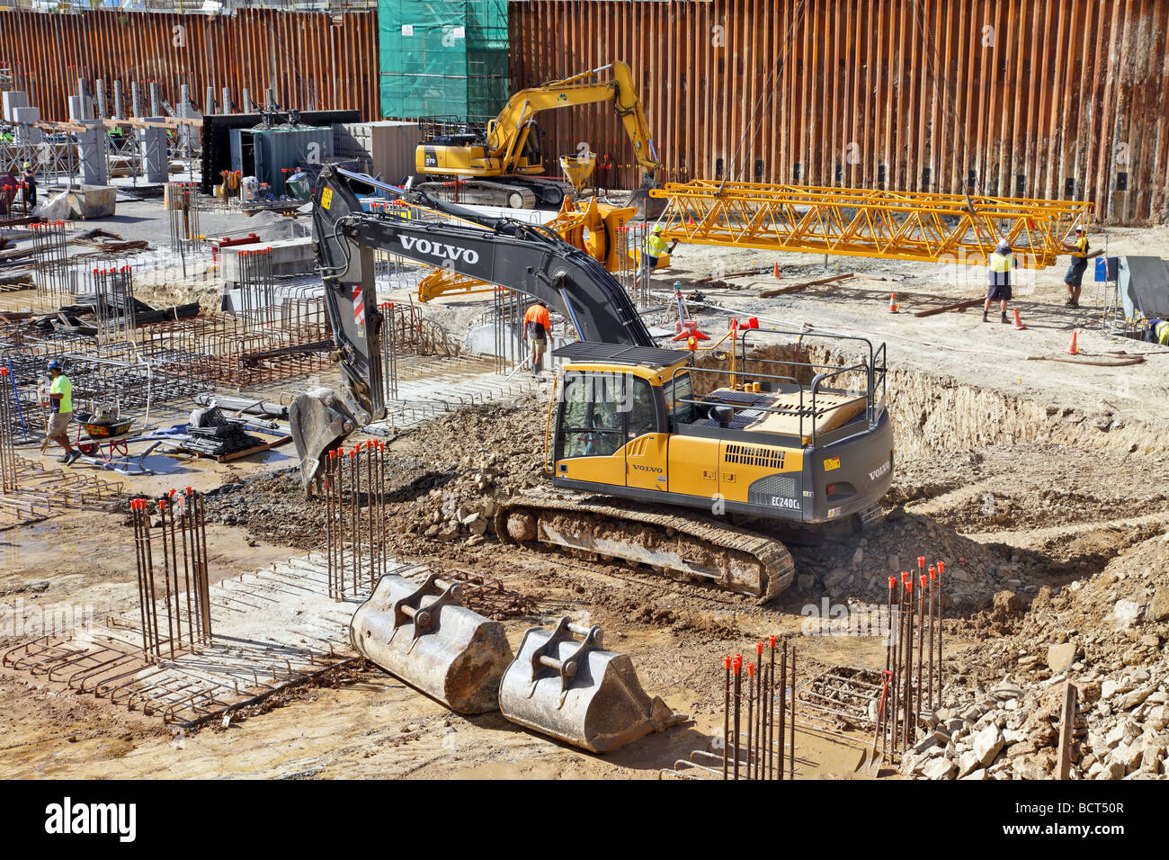 Constructing the concrete and steel foundations for a highrise building ...