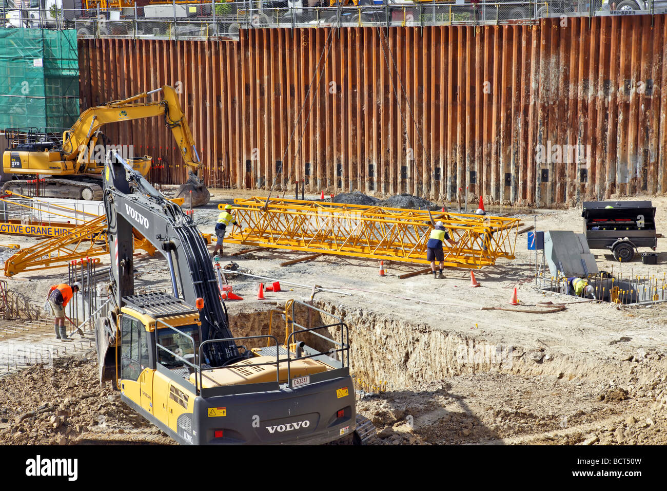 Constructing the concrete and steel foundations for a highrise building ...