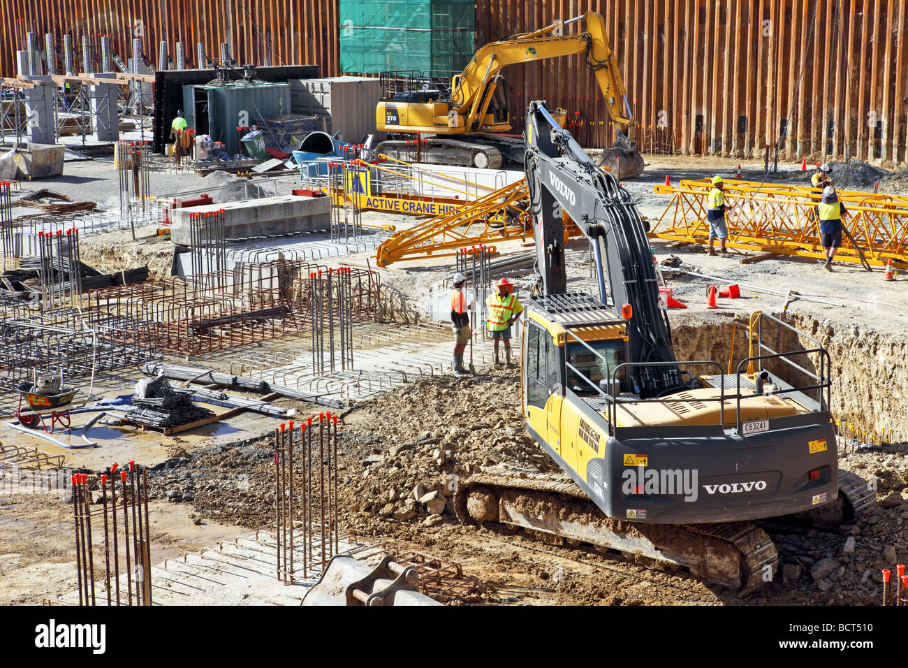Constructing the concrete and steel foundations for a highrise building ...