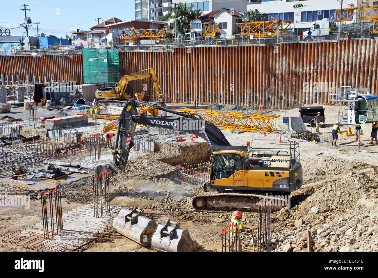 Constructing the concrete and steel foundations for a highrise building ...