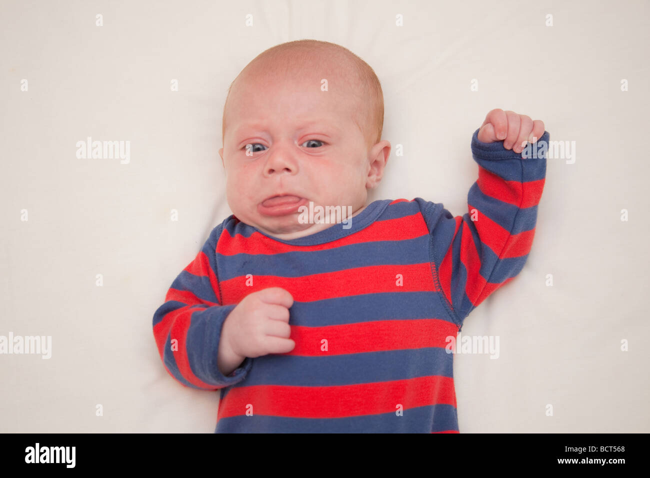 Two month old baby boy wearing a red and blue striped suit, London ...