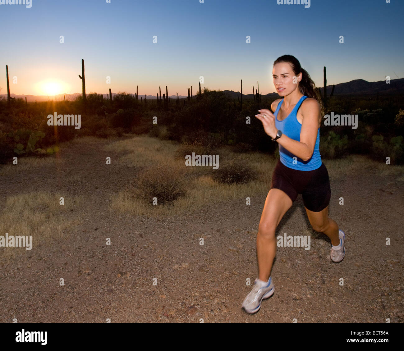 Young lady running in the desert at sunset hi-res stock photography and ...