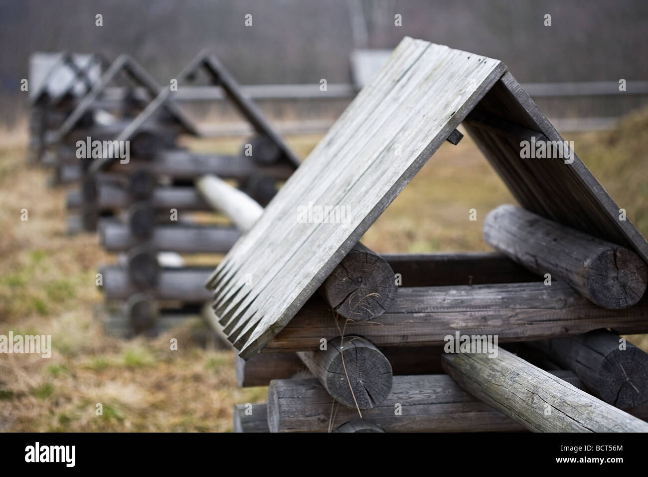 village fence made from wooden logs with small turrets in Russian style ...