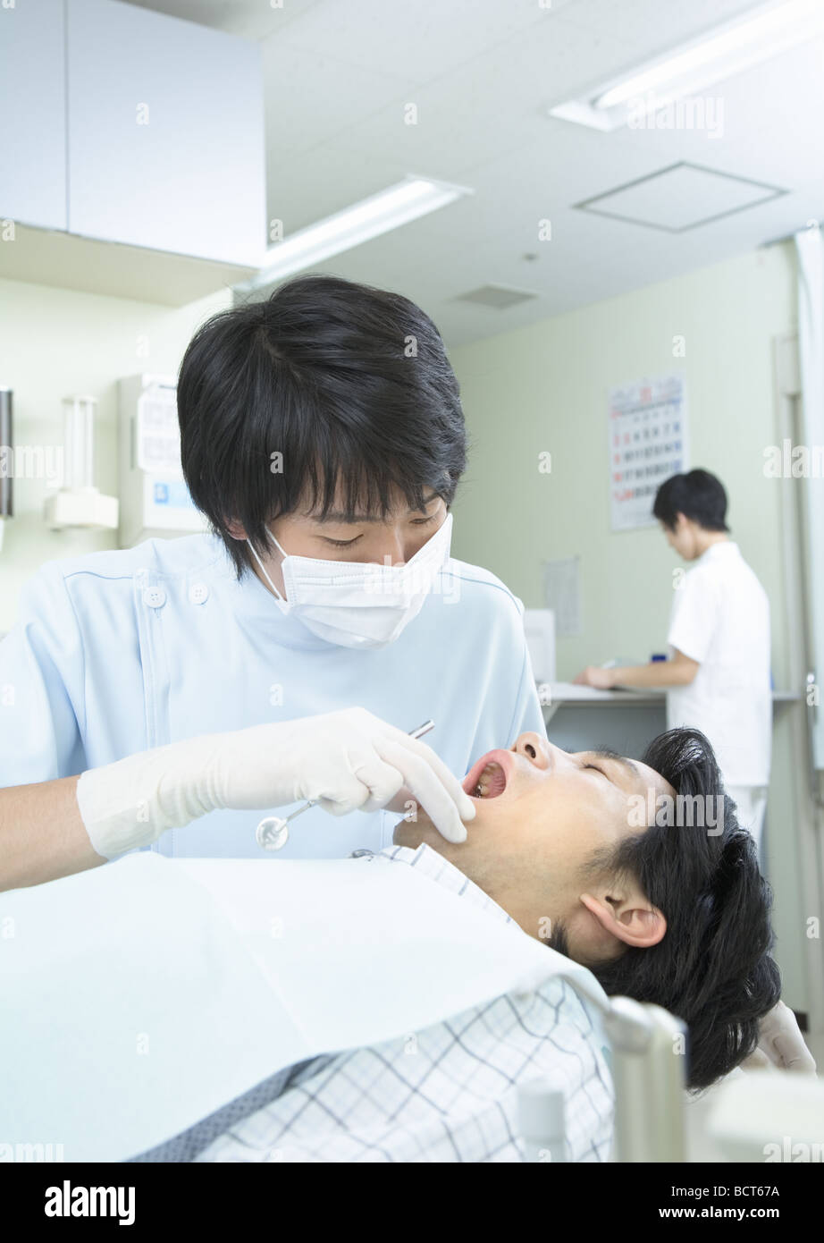 Treating teeth hi-res stock photography and images - Alamy