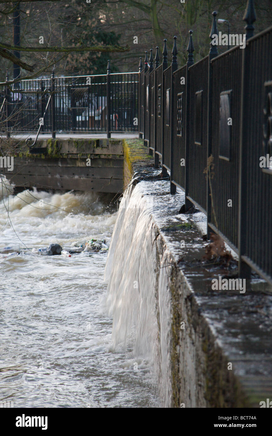 Flood water running off a bridge over the river colne in Colchester ...