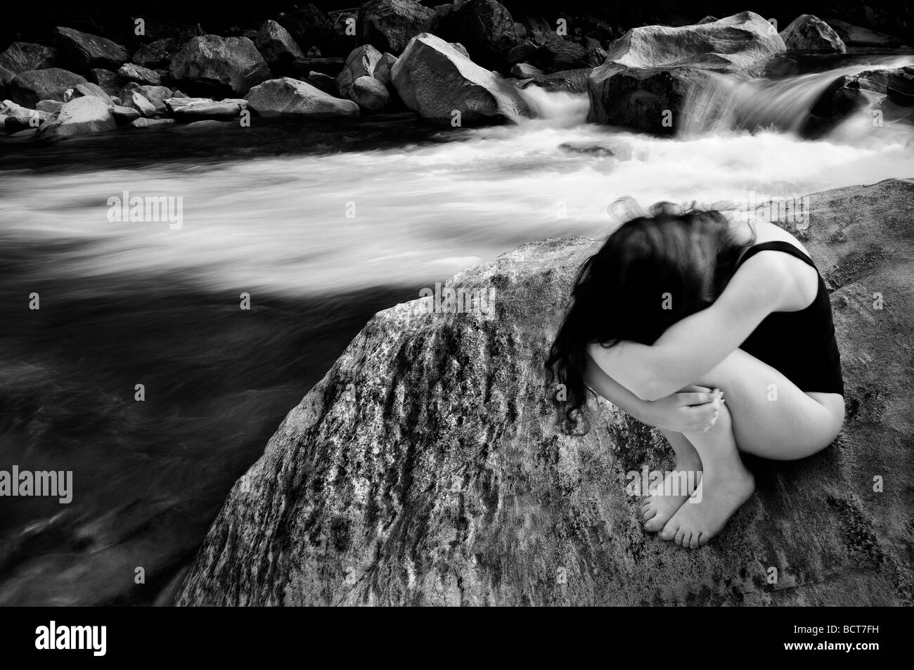 Girl near a river Stock Photo - Alamy